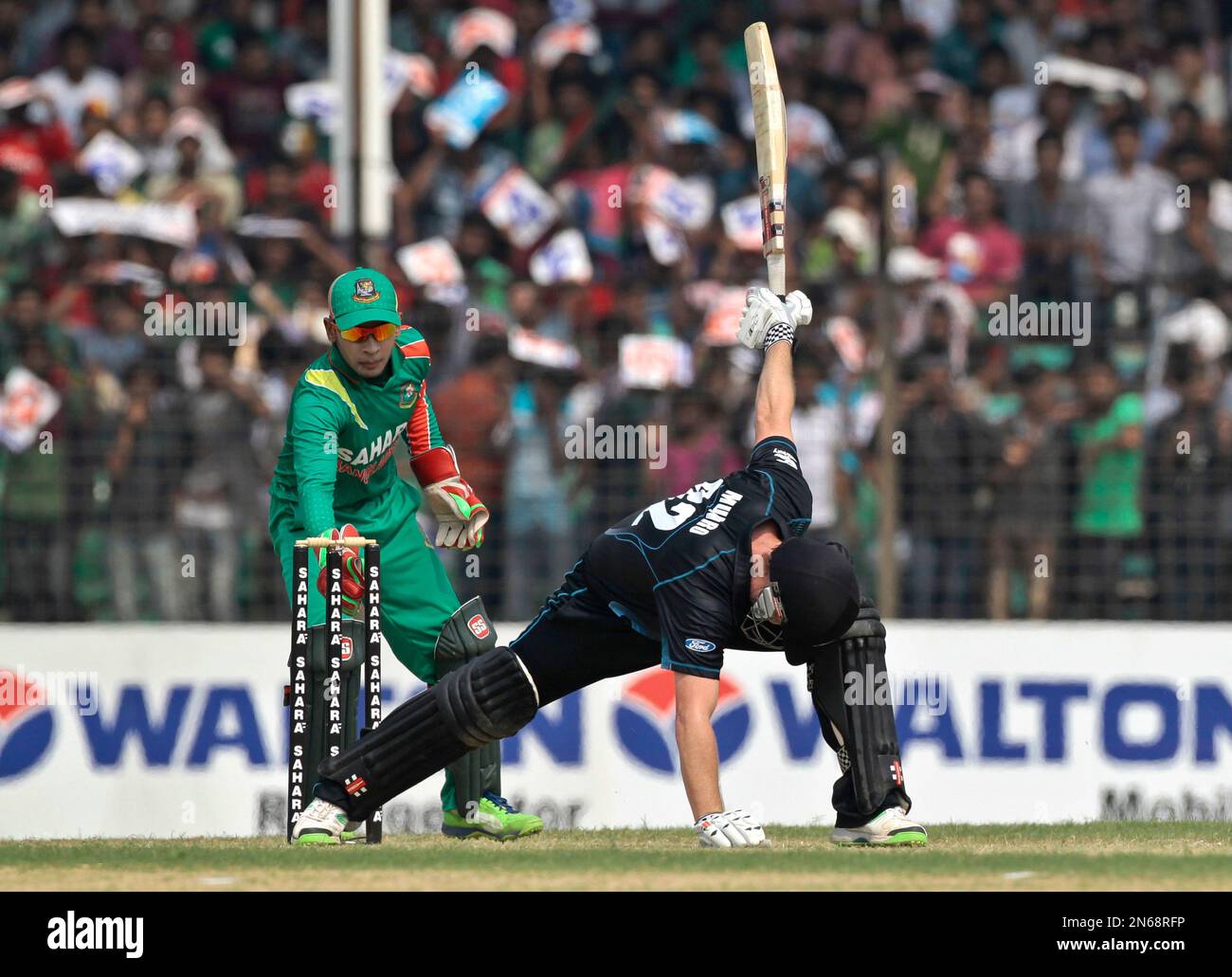 Bangladesh's captain Mushfiqur Rahim, left, watches New Zealand's ...