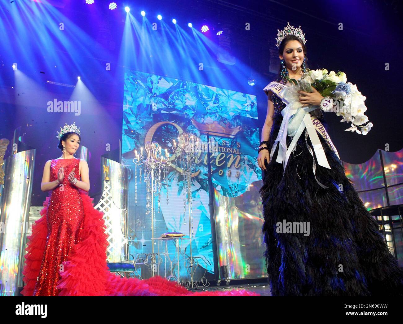 Marcelo Ohio of Brazil, right, walks after she was crowned Miss ...
