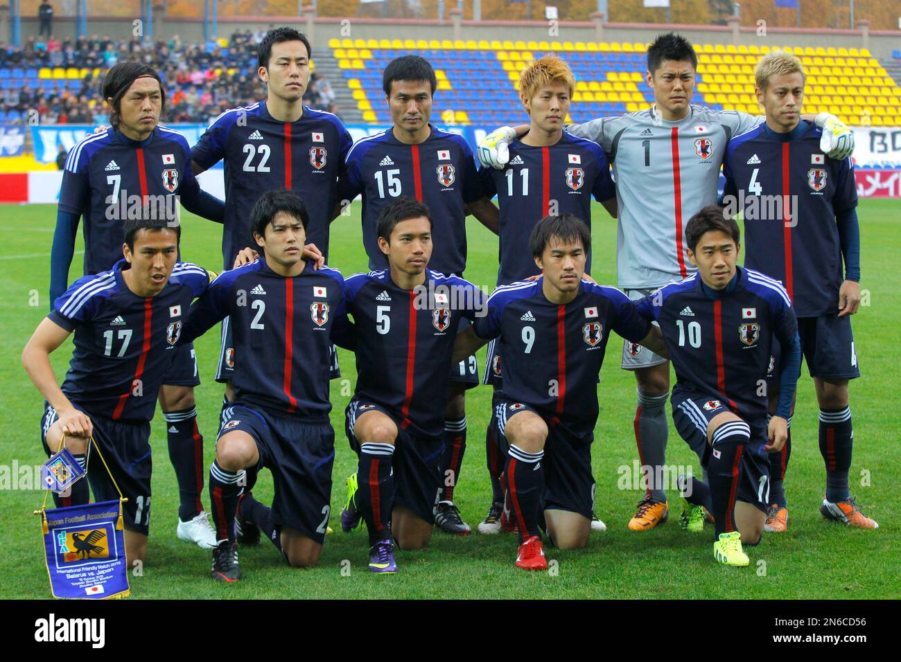 Japan's national team line up, back from left to right, Yasuhito Endo ...