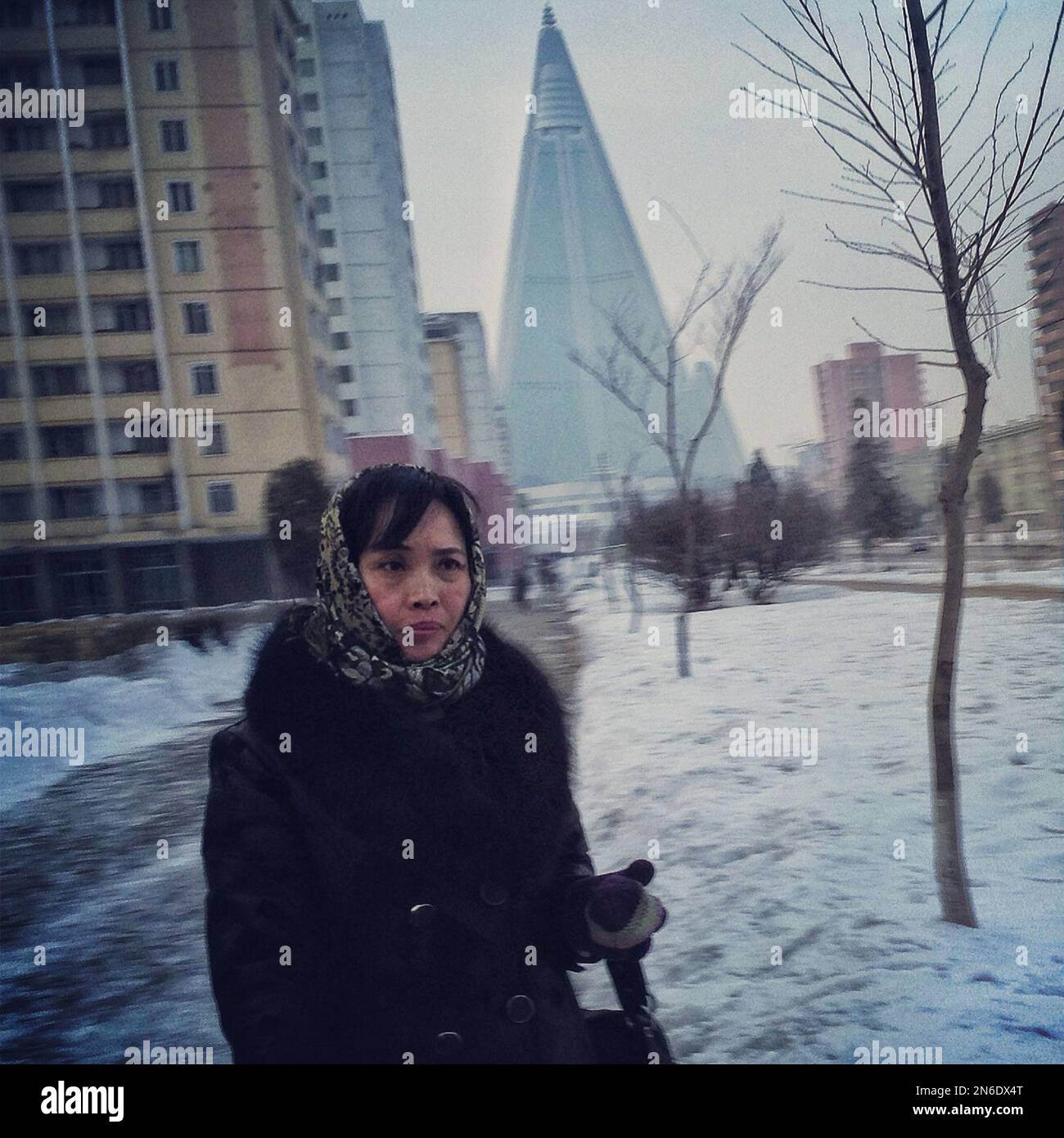 In this January 15, 2013 photo taken with an iPod Touch, a woman walks ...