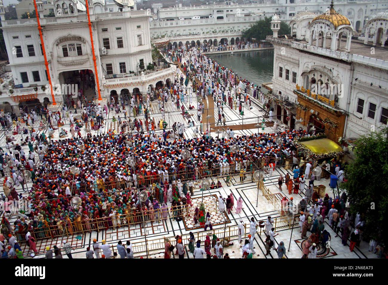 Sikh devotees throng the Golden Temple, Sikh's holiest shrine, during ...