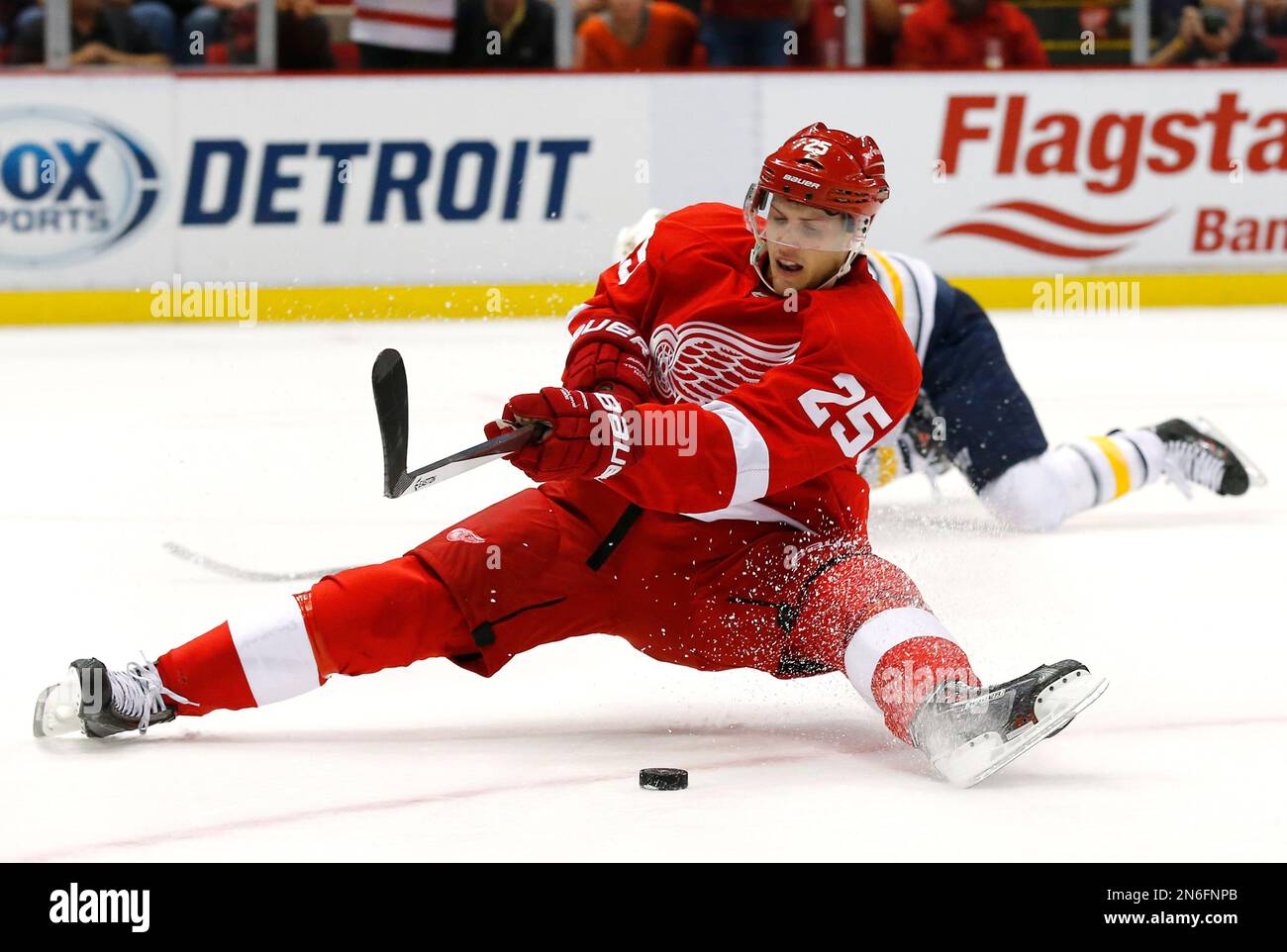 Detroit Red Wings center Cory Emmerton (25) tries to shoot after being ...