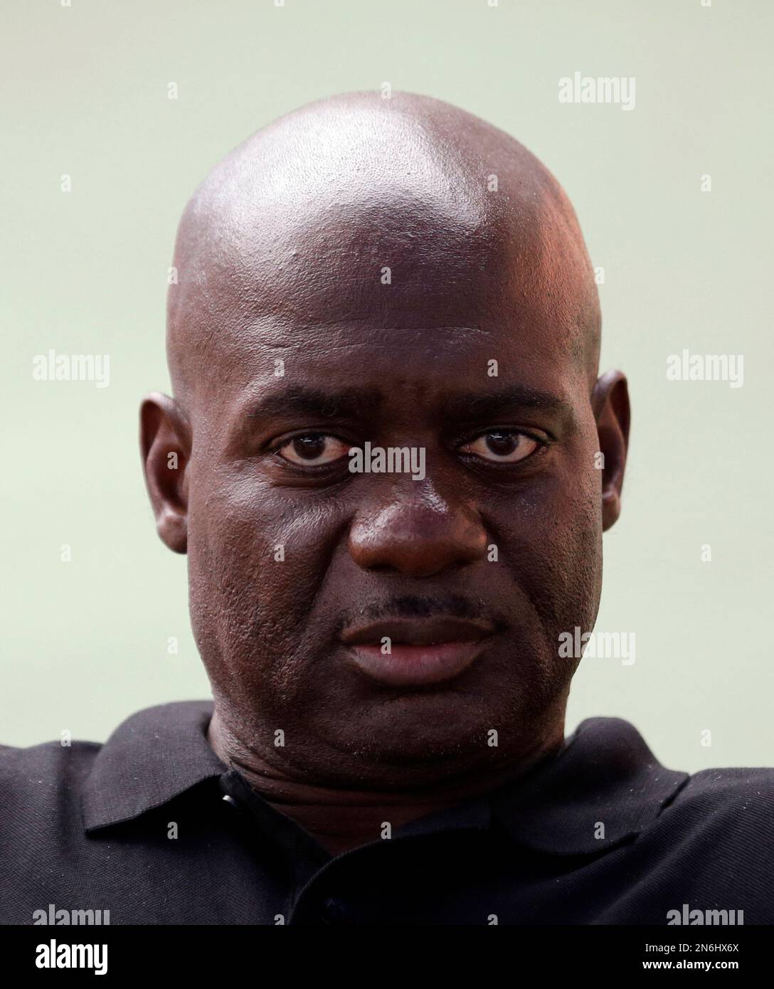 Canada's former sprinter Ben Johnson poses as he stands in the track ...