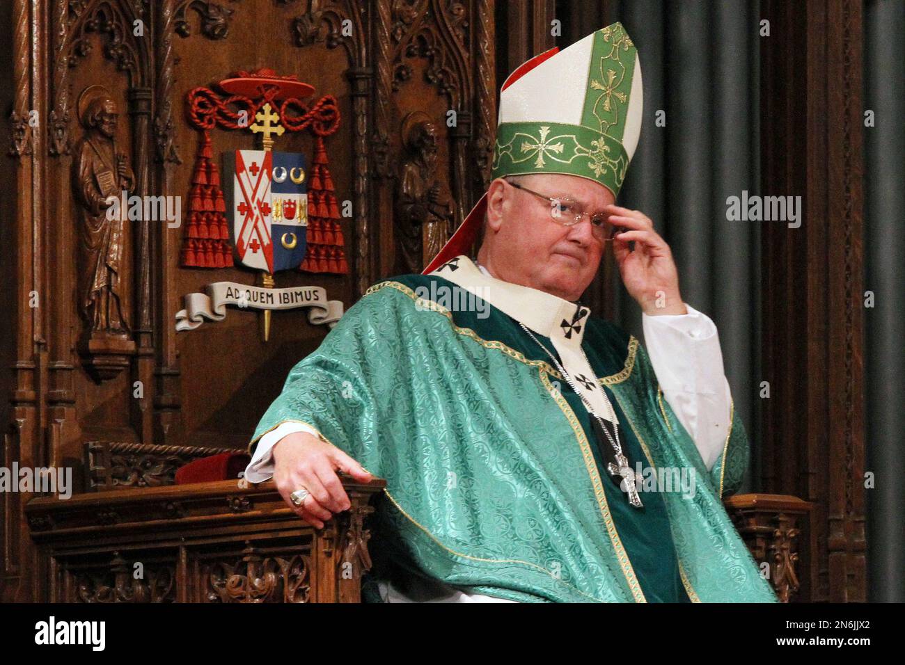 Cardinal Timothy Dolan, listens during Mass, Sunday, Sept. 22, 2013, at ...