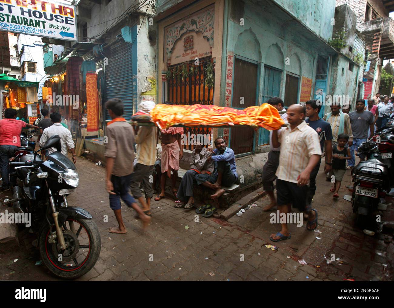 In this Monday, Sept. 2, 2013 photo, Hindus carry a dead body for ...