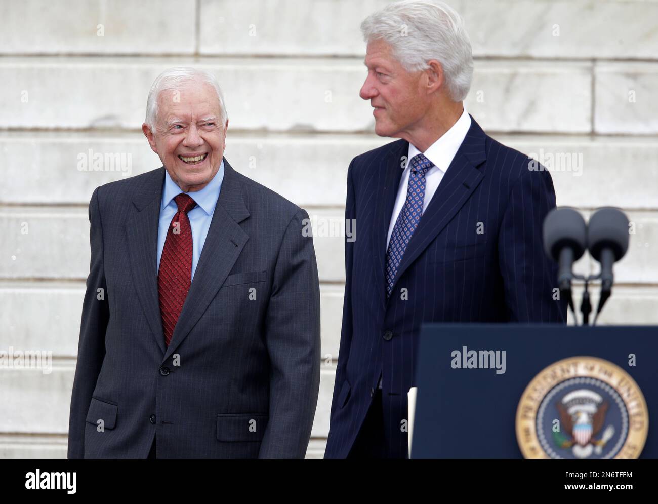 Former President Jimmy Carter looks to former President Bill Clinton as ...