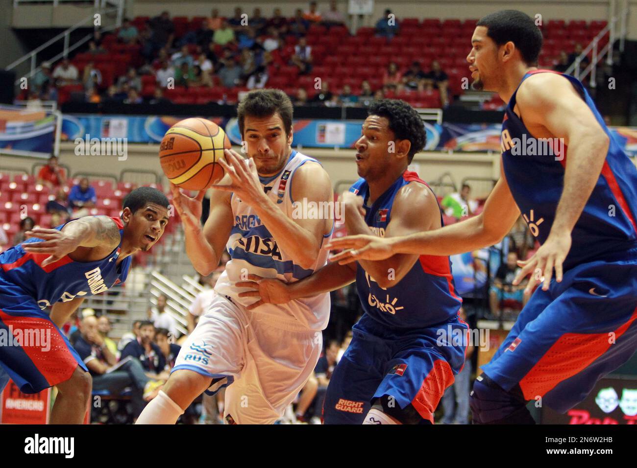 Argentina’s Selem Safar, second from left, drives to the basket against ...