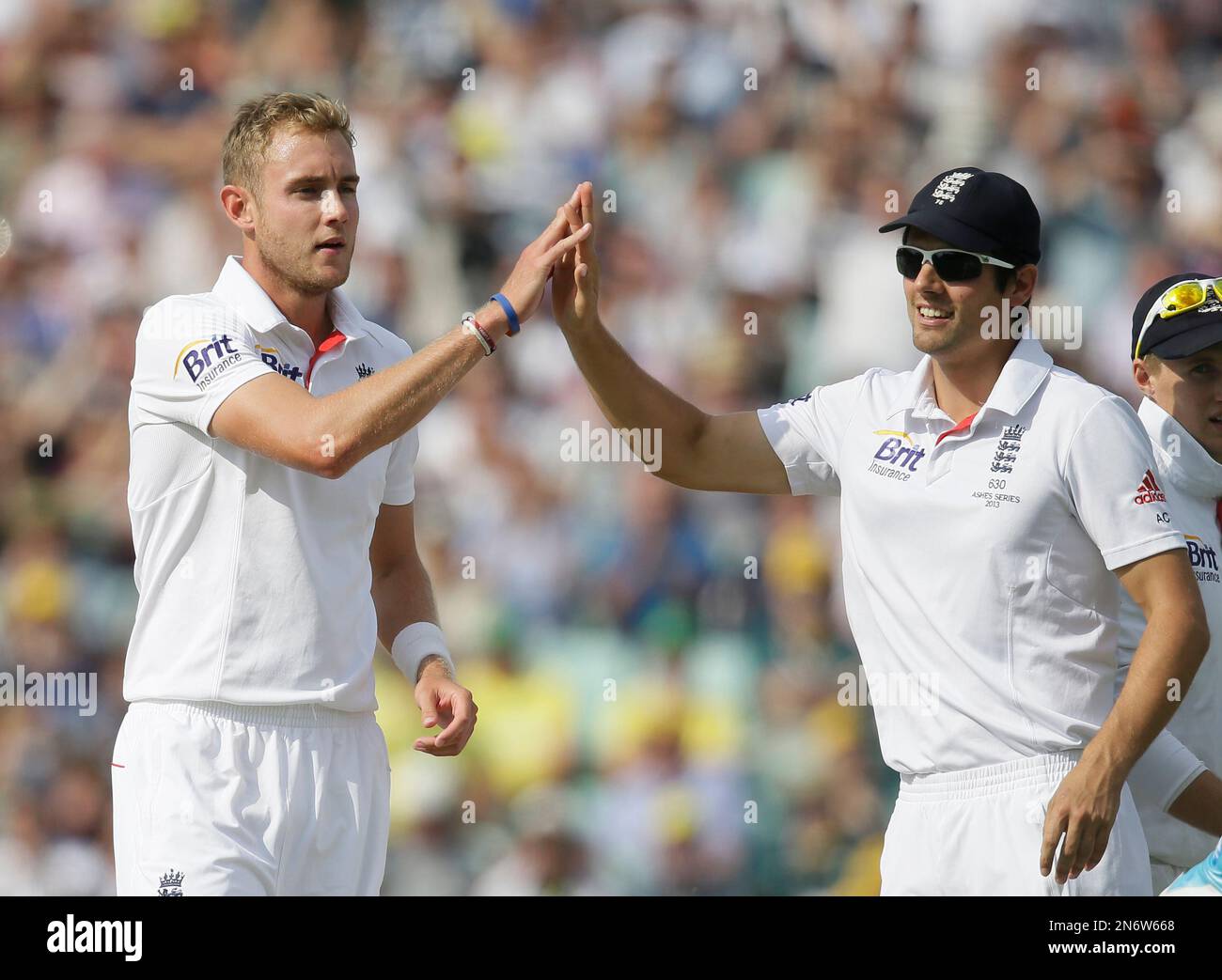 England's Stuart Broad, left celebrates with teammate and captain ...