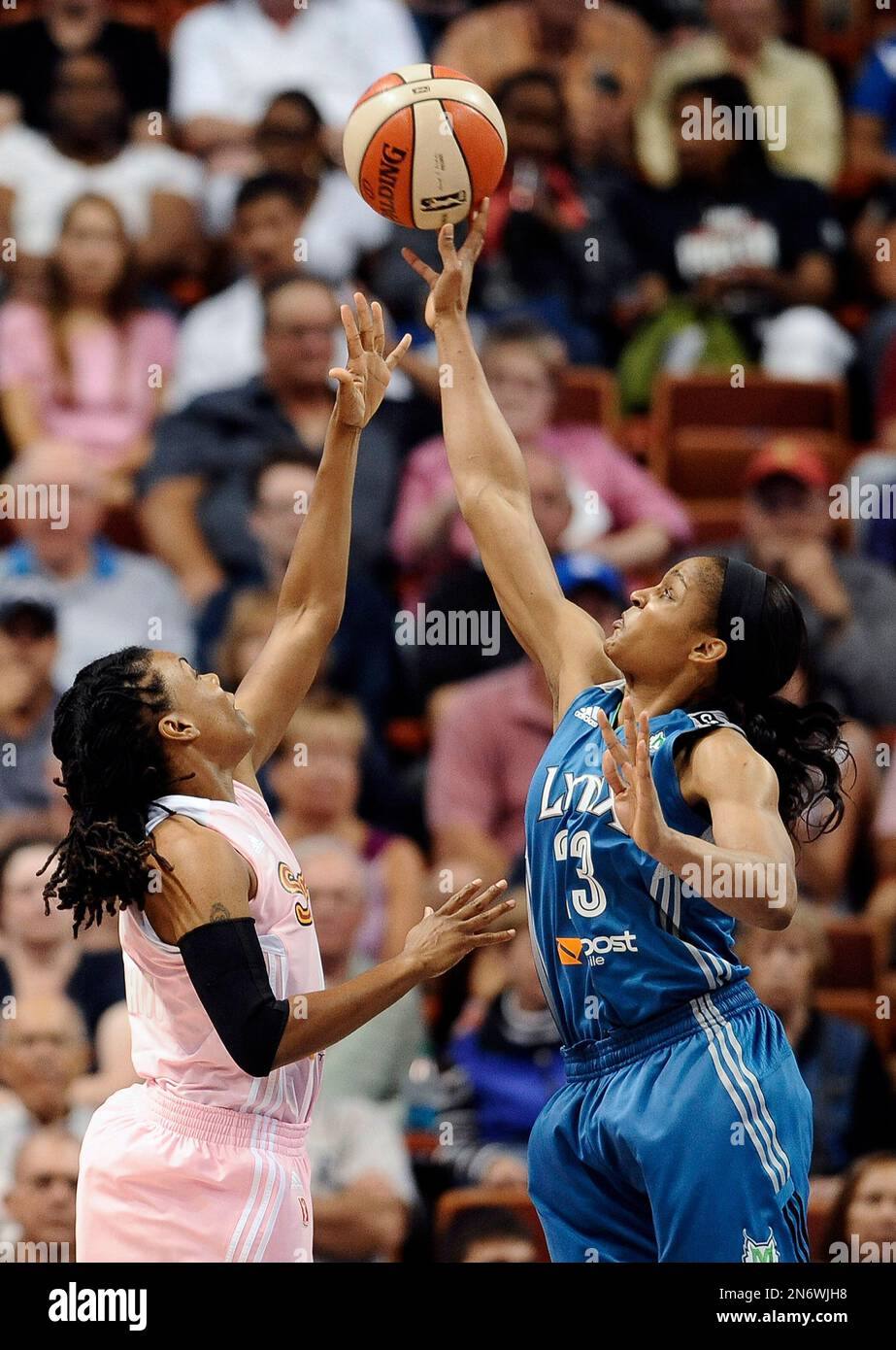 Minnesota Lynx's Maya Moore, right, blocks a shot attempt by ...