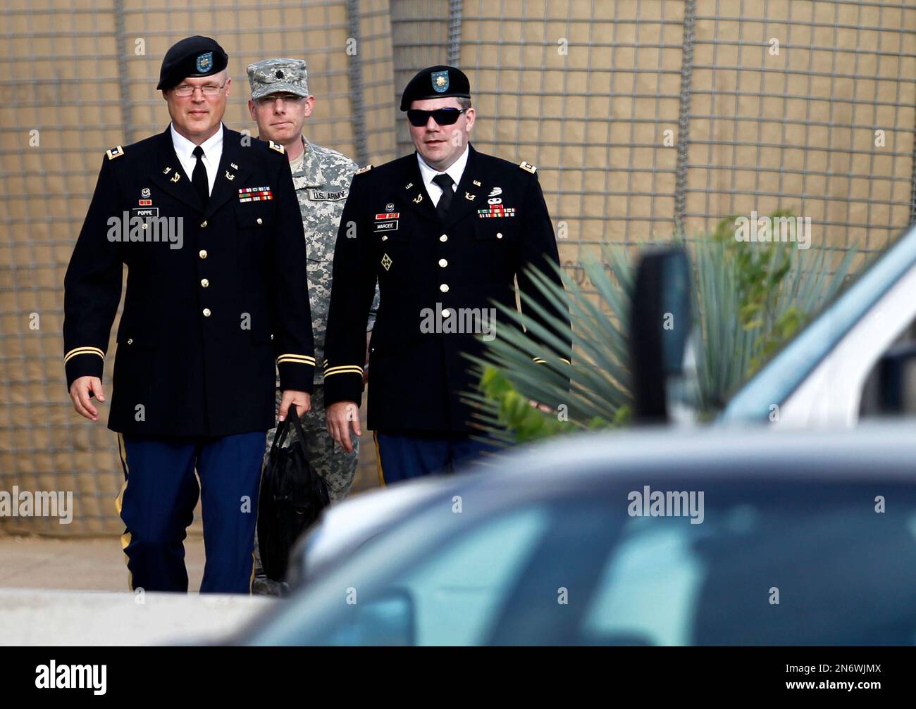 From left, members of the defense, U.S. Army Lt. Col. Kris R. Poppe ...