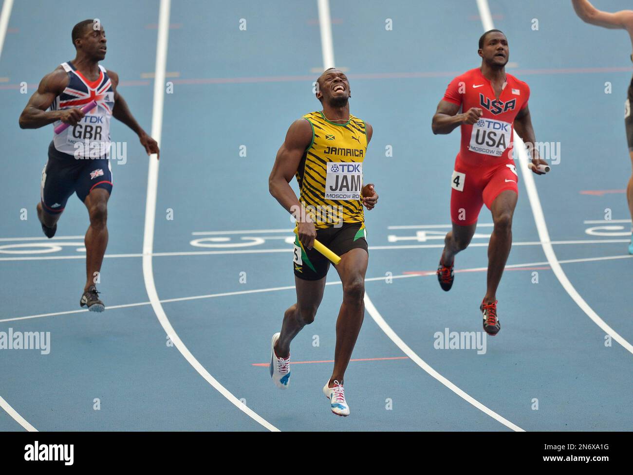 Jamaica's Usain Bolt, center, reacts after winning ahead of United ...