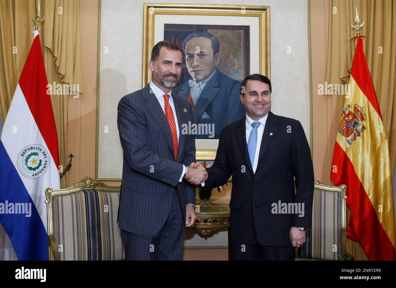 Spain's Crown Prince Felipe, left, shakes hands with Paraguay's ...
