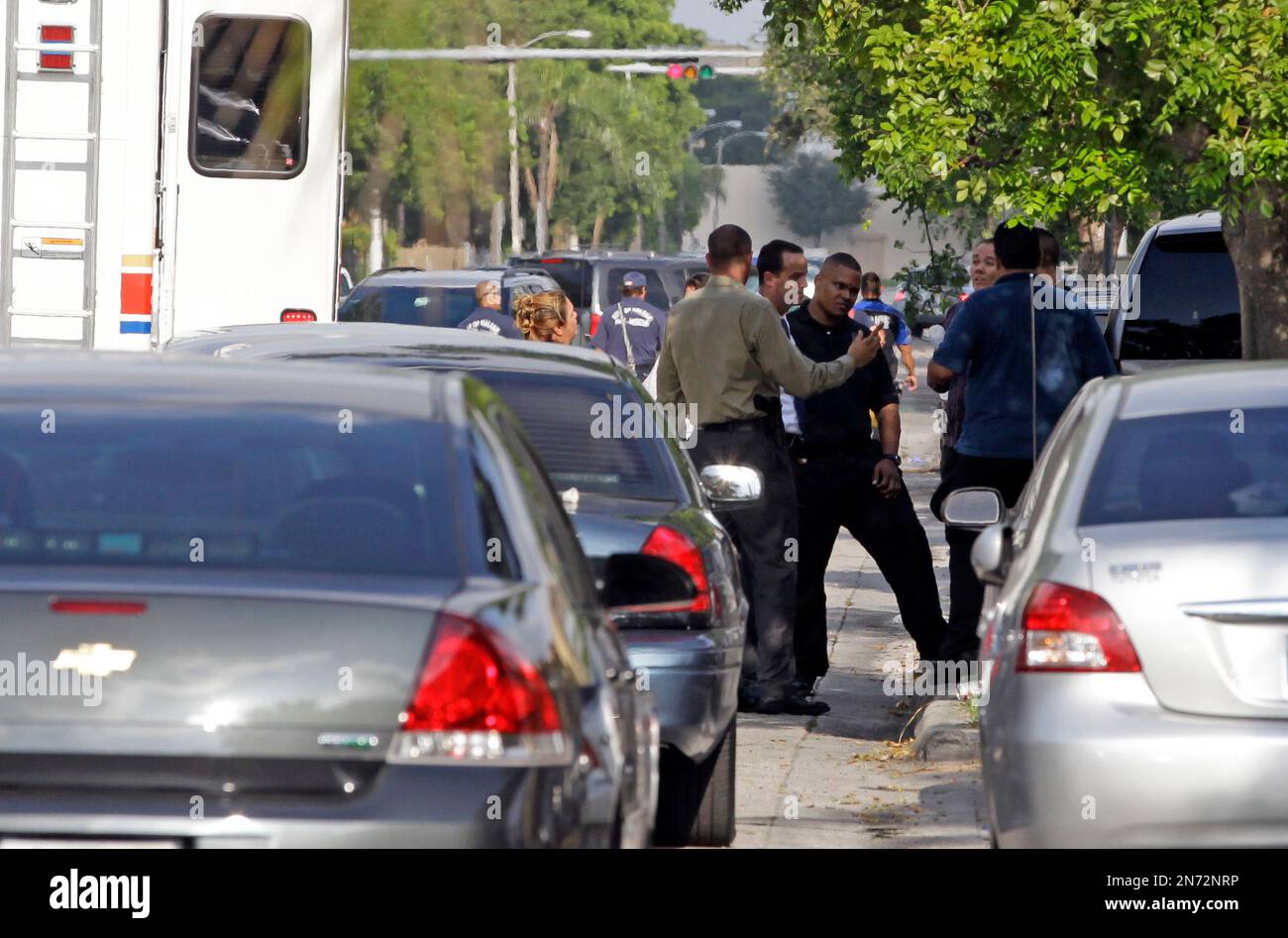 City of Hialeah, Fla. police officers talk outside an apartment ...