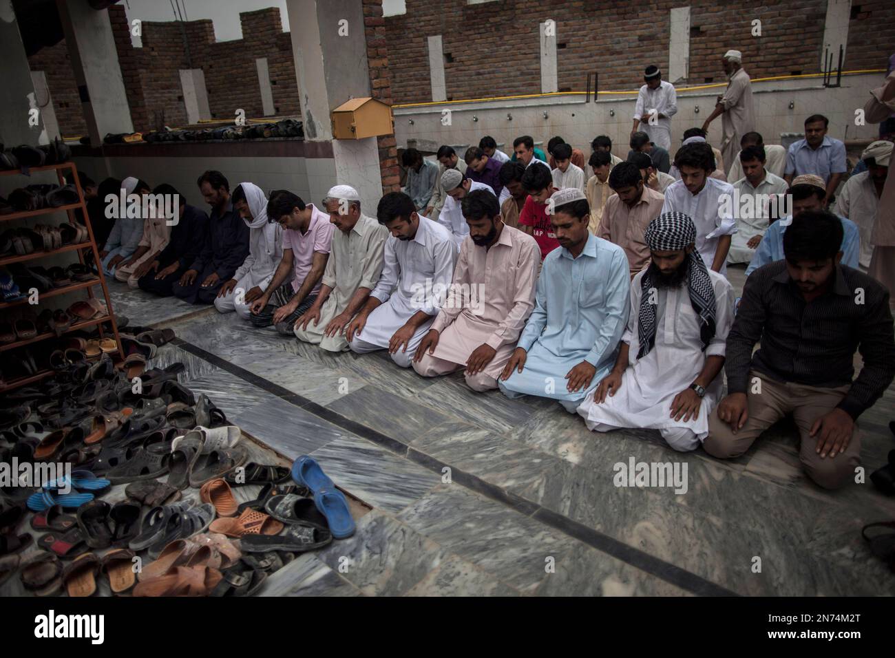 Pakistani Muslim worshippers attend Friday prayers in a Mosque that ...