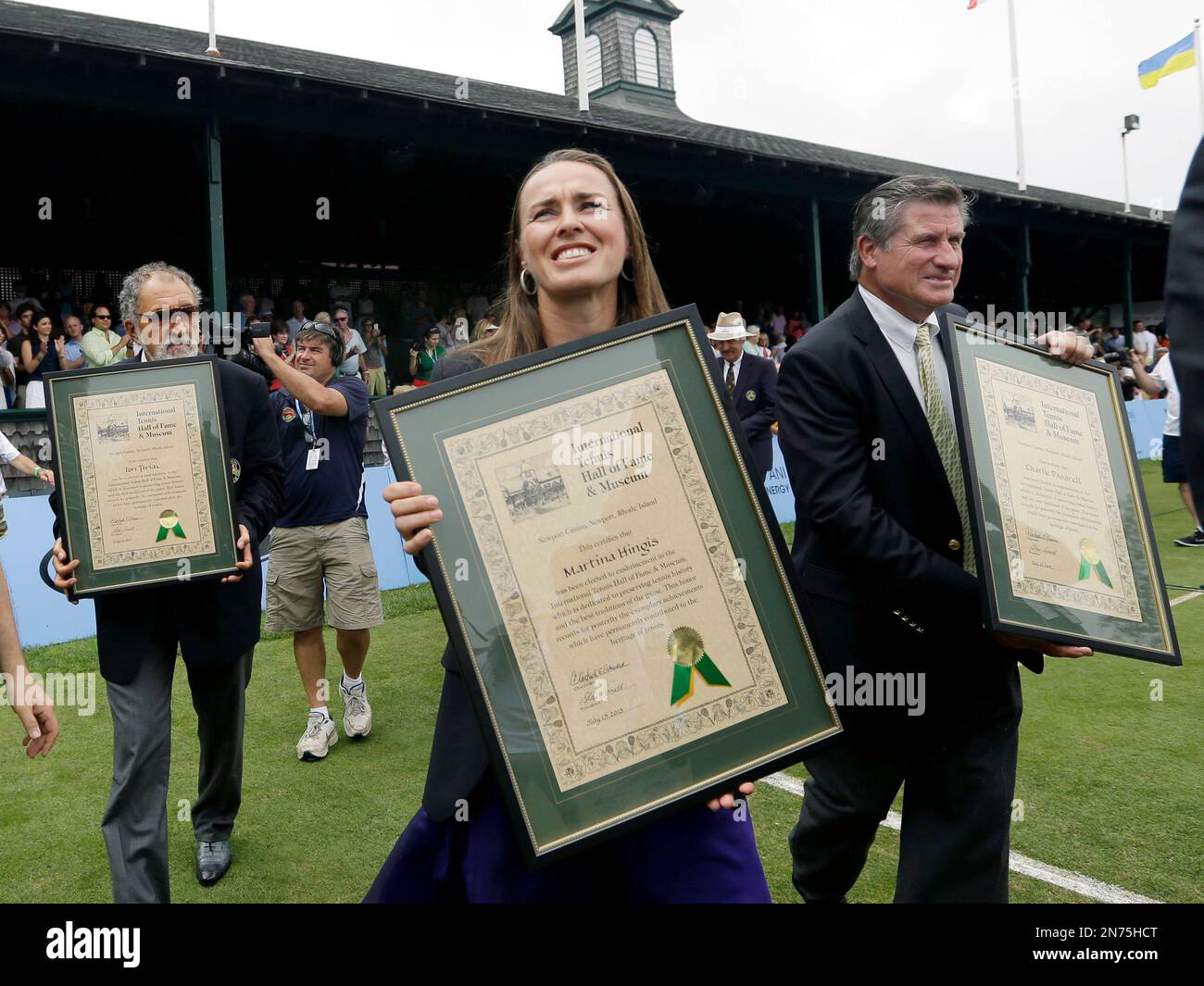 Inductees Ion Tiriac, of Romania, left, Martina Hingis, of Switzerland ...