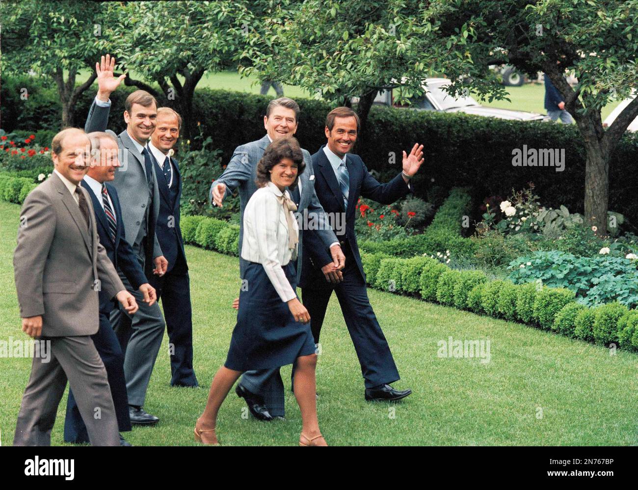 President Ronald Reagan walks with members of the crew of the Space ...