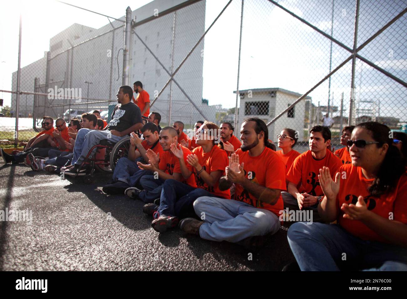 Protestors sit in front of the main entrance of the Metropolitan ...