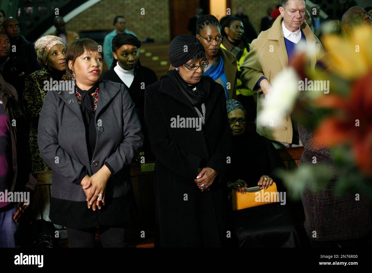 Zindzi Mandela, left and Winnie Mandela, center, participate in a ...