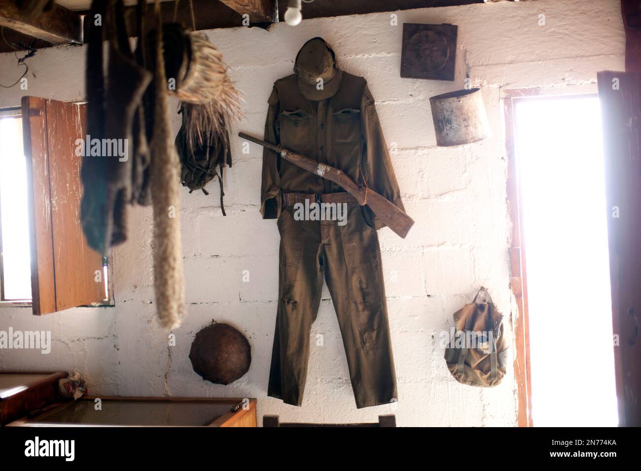 In this May 22, 2013 photo, a guerrilla fighter uniform and rifle is ...