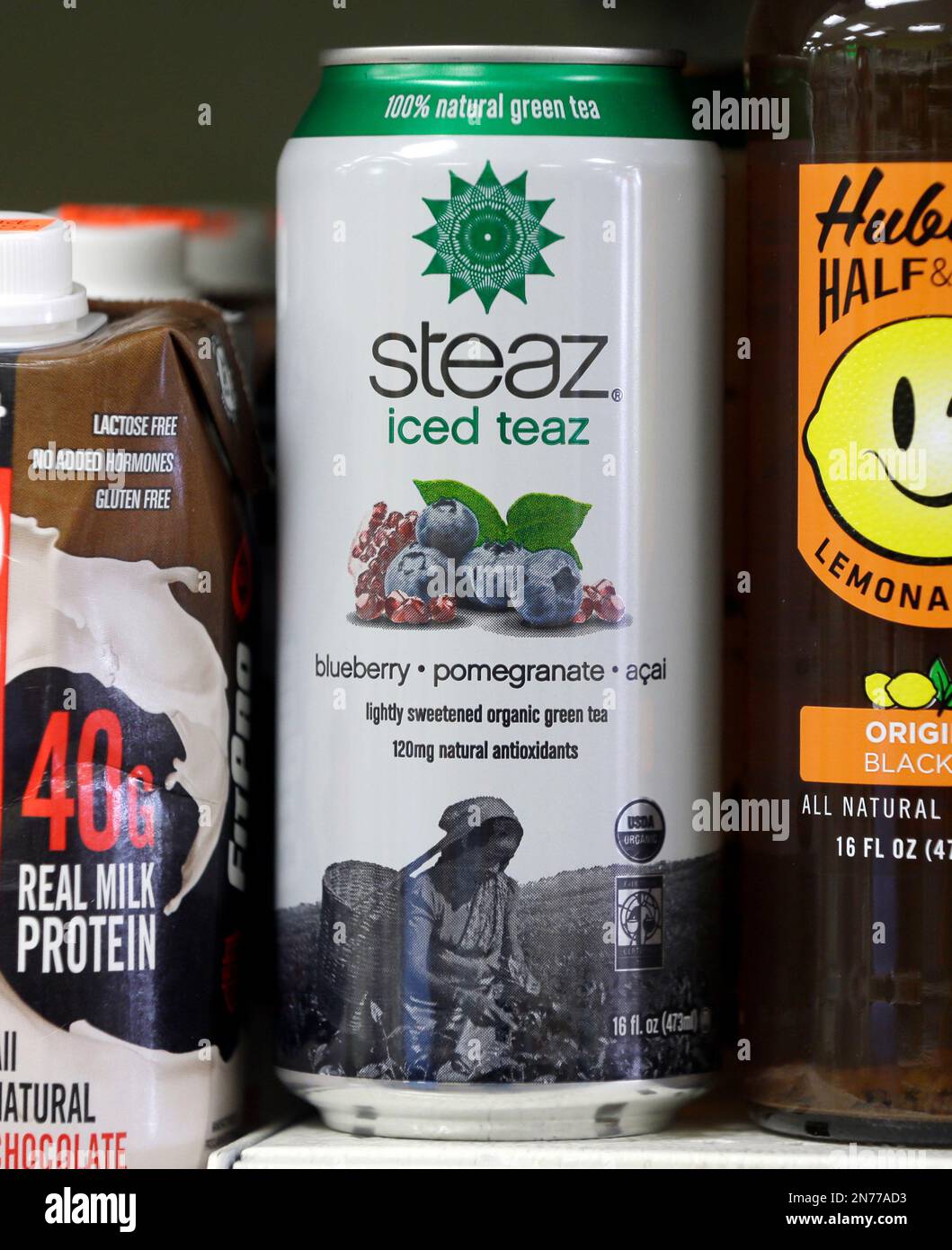 In this Thursday, June 27, 2013 photo, a can of Steaz natural green tea ...