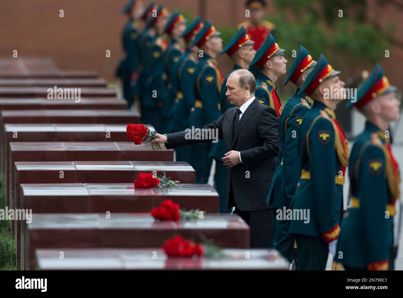 Russian President Vladimir Putin takes part in a wreath laying ceremony ...