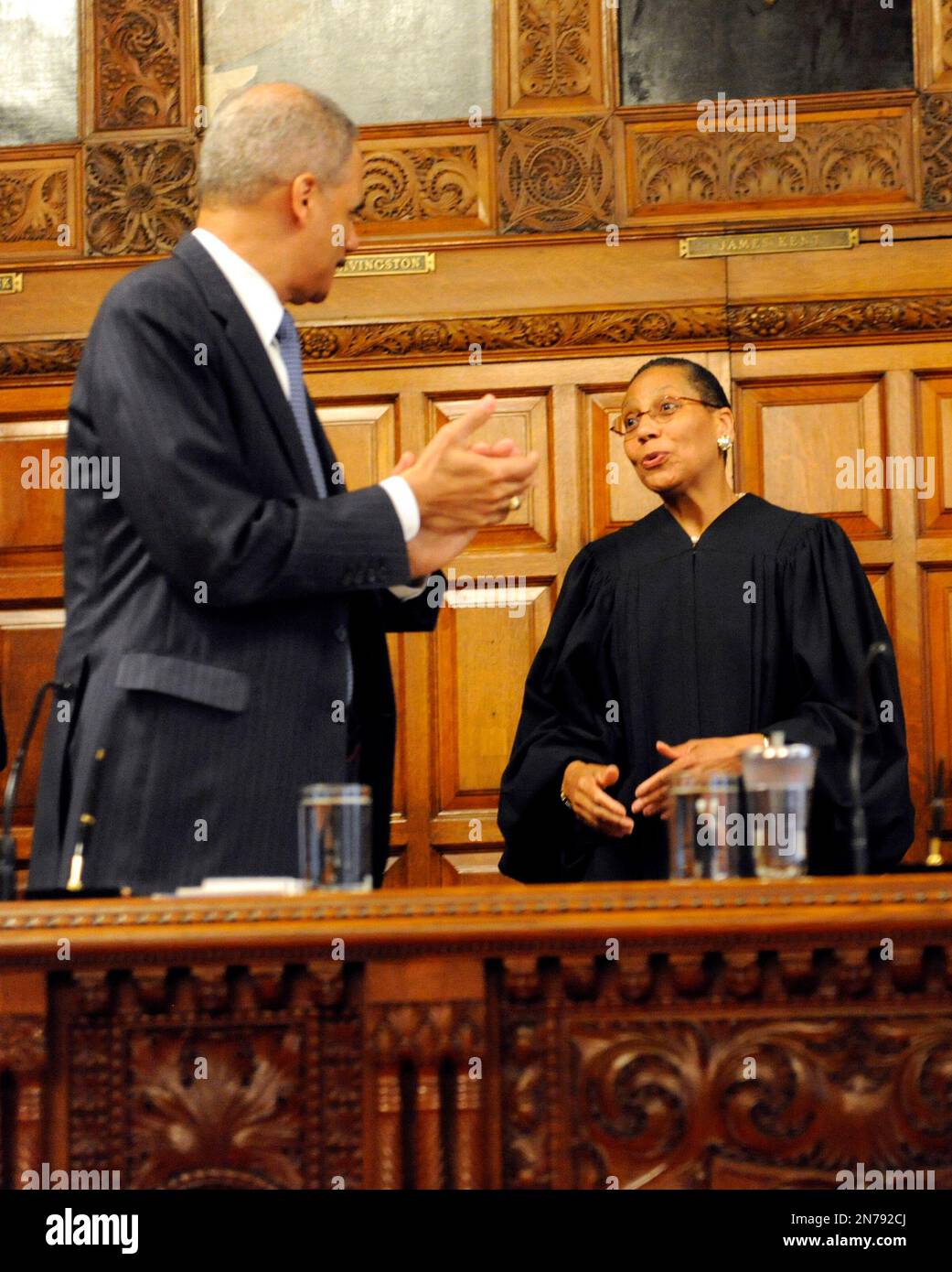 U.S. Attorney General Eric Holder, left, speaks with Court of Appeals ...