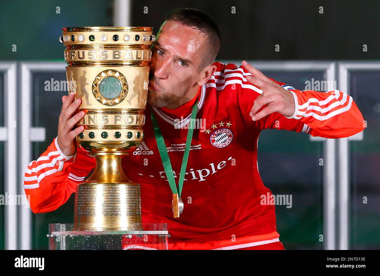 Bayern's Franck Ribery of France poses with the trophy during the ...