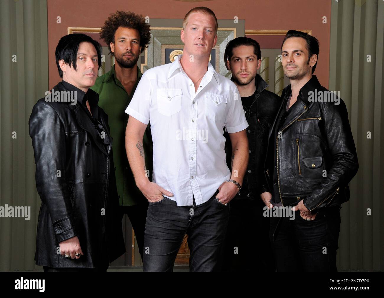 In this May 23, 2013 photo, members of the band Queens of the Stone Age ...