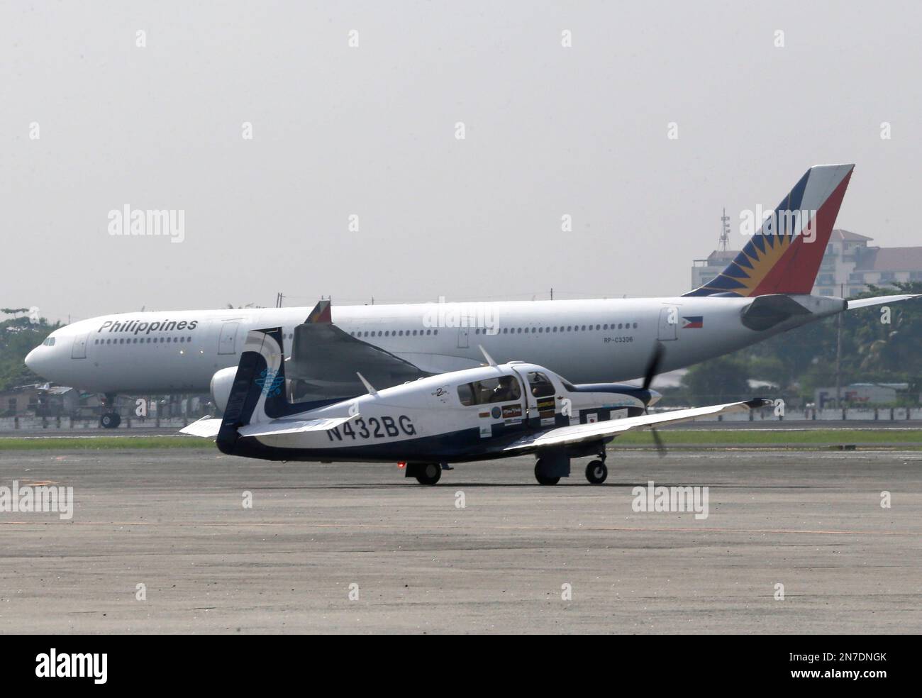 A Philippine Airlines passenger passenger plane lands as Mooney M20 ...