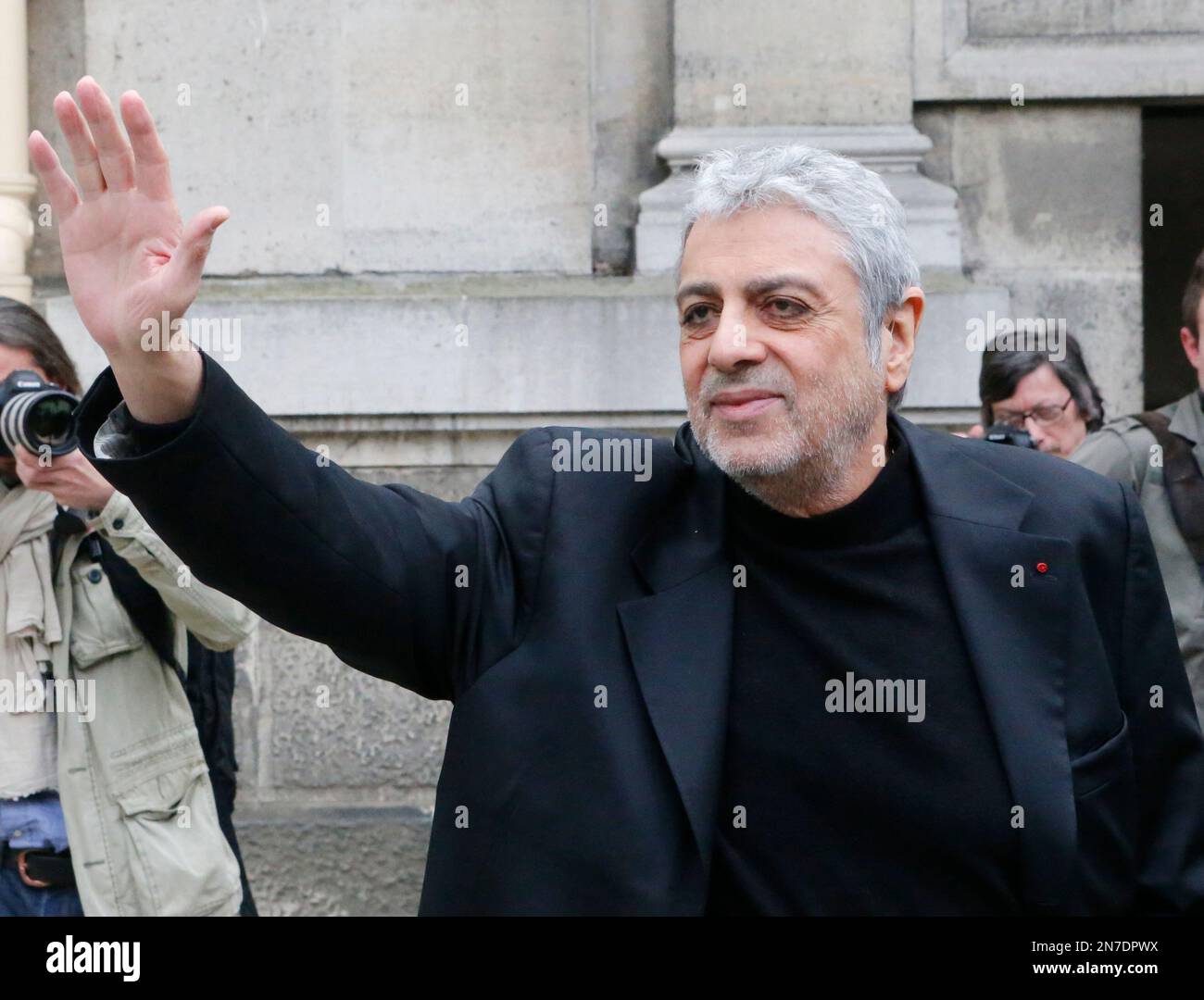 French Singer Enrico Macias waves as he arrives for the memorial ...