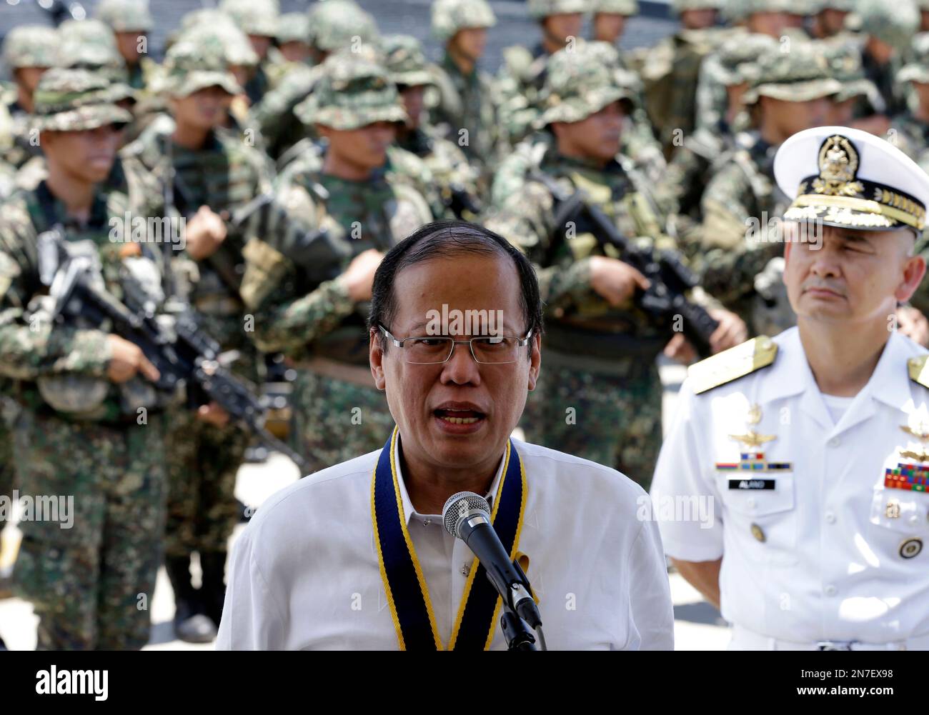 With Philippine Marines in the background, Philippine President Benigno ...