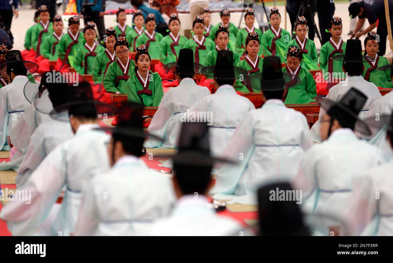 Girls and boys wearing traditional dresses attend at the 41st Coming of ...