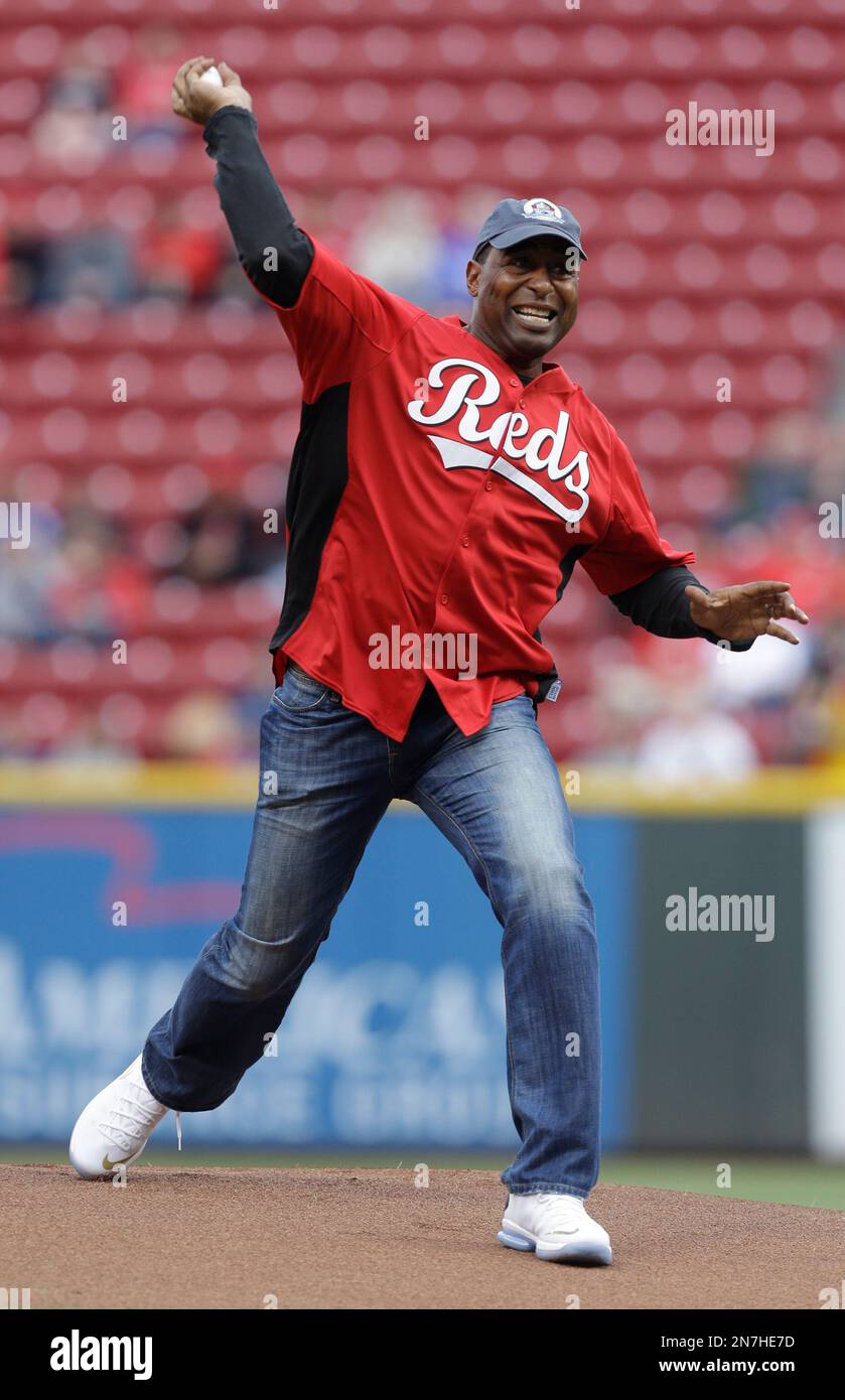 Former NFL great Cris Carter throws out a ceremonial first pitch prior ...