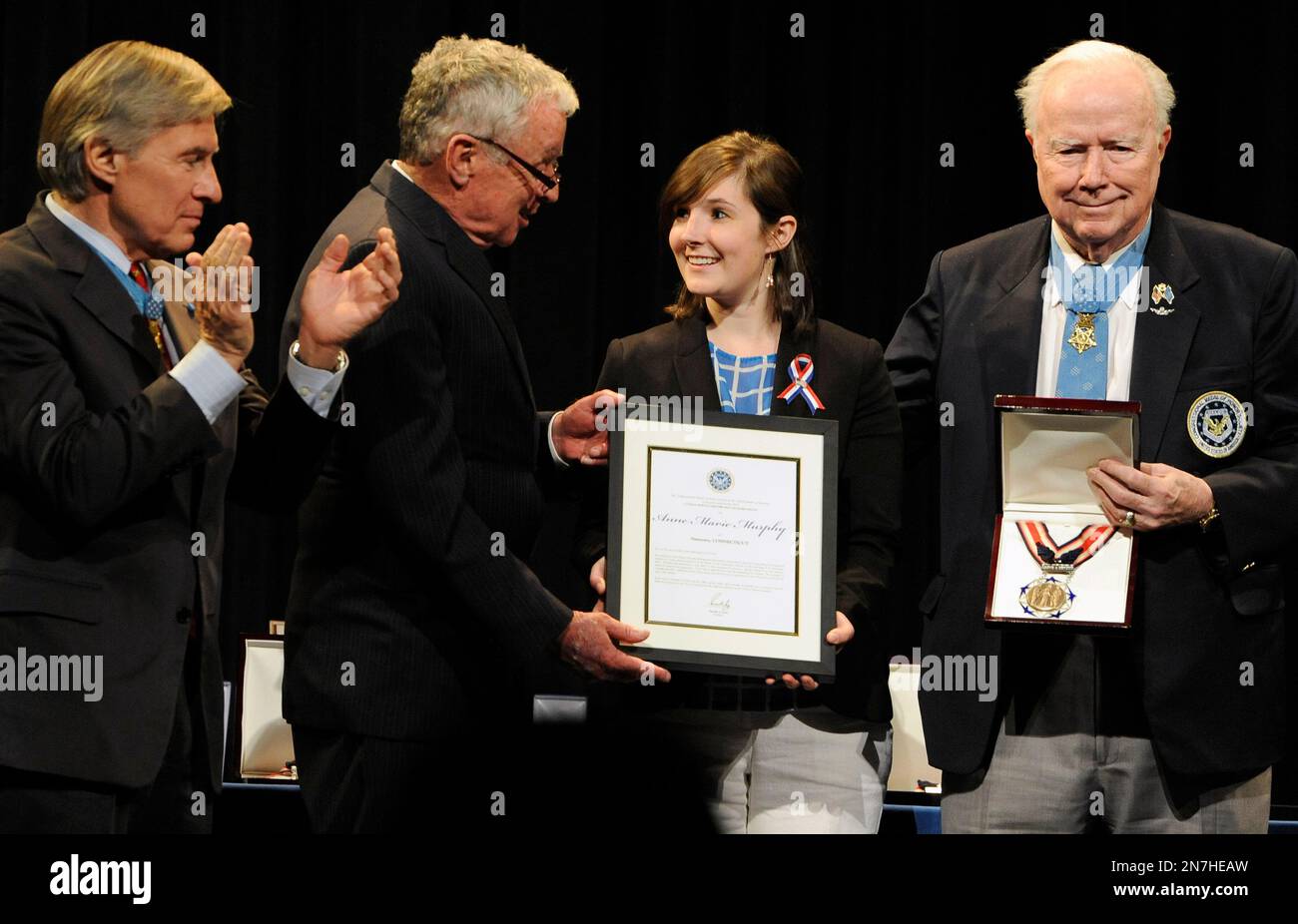 Kelly Murphy, second from right, accepts the citizen honor from the ...