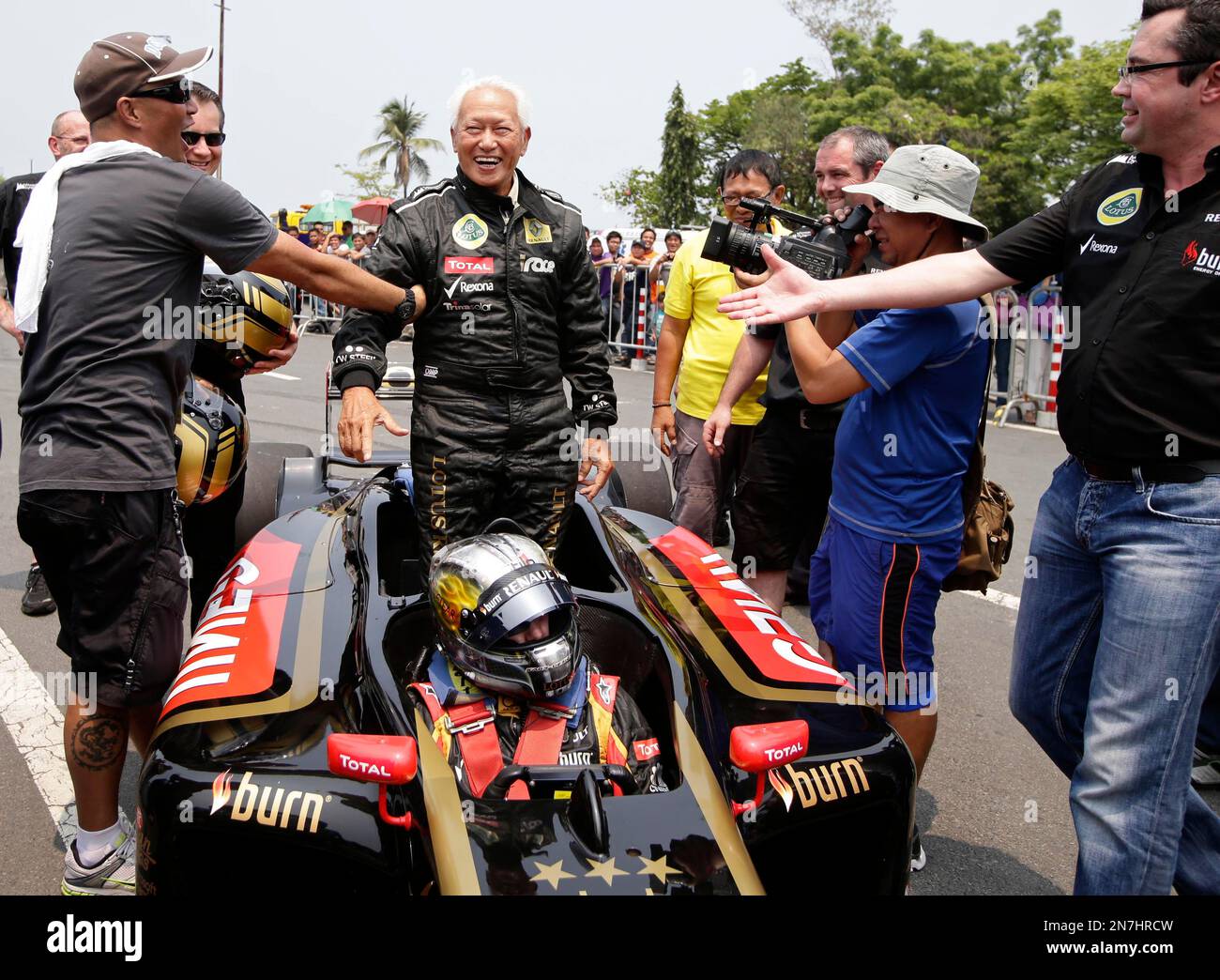 Manila Mayor Alfredo Lim smiles after a short ride in a modified two ...