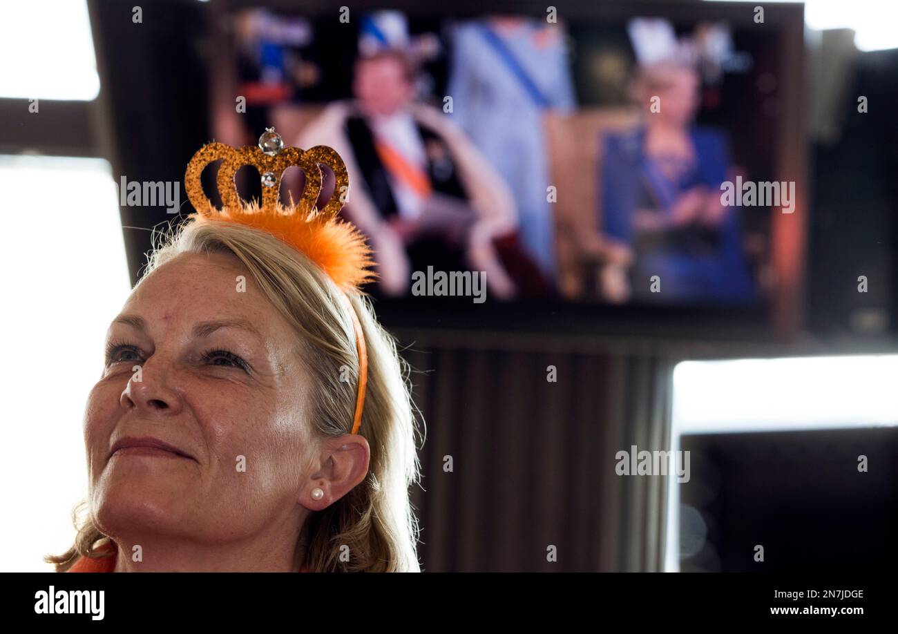 A woman watches one of the screens broadcasting the inauguration of ...