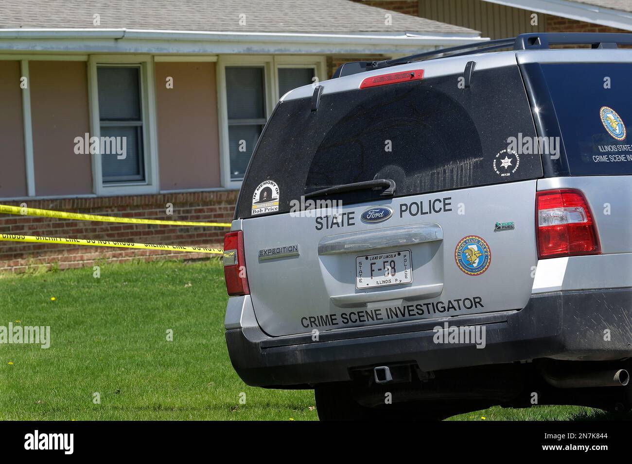 An Illinois State Police Crime Scene Investigator truck is parked ...