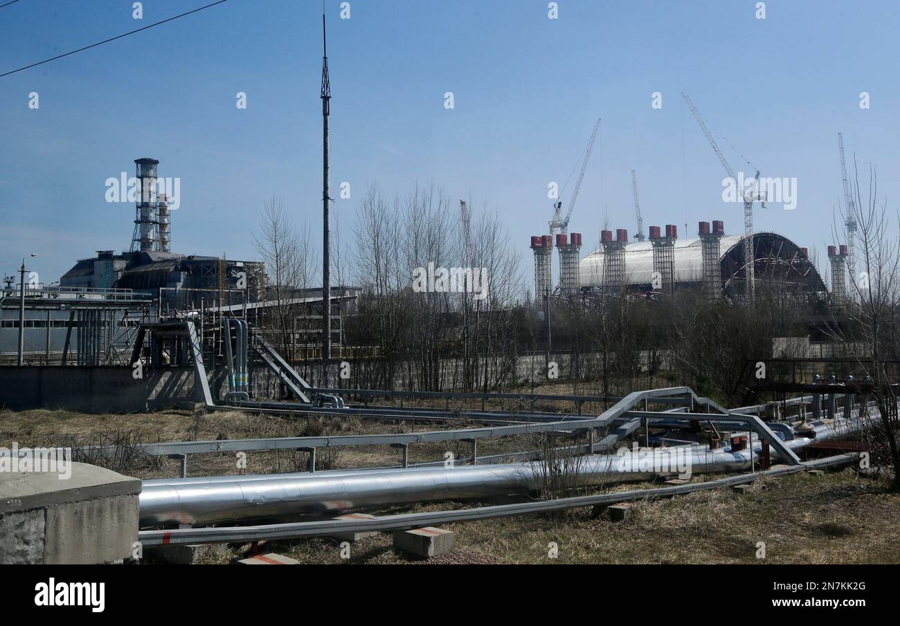 A chimney over the destroyed reactor at the Chernobyl nuclear power ...