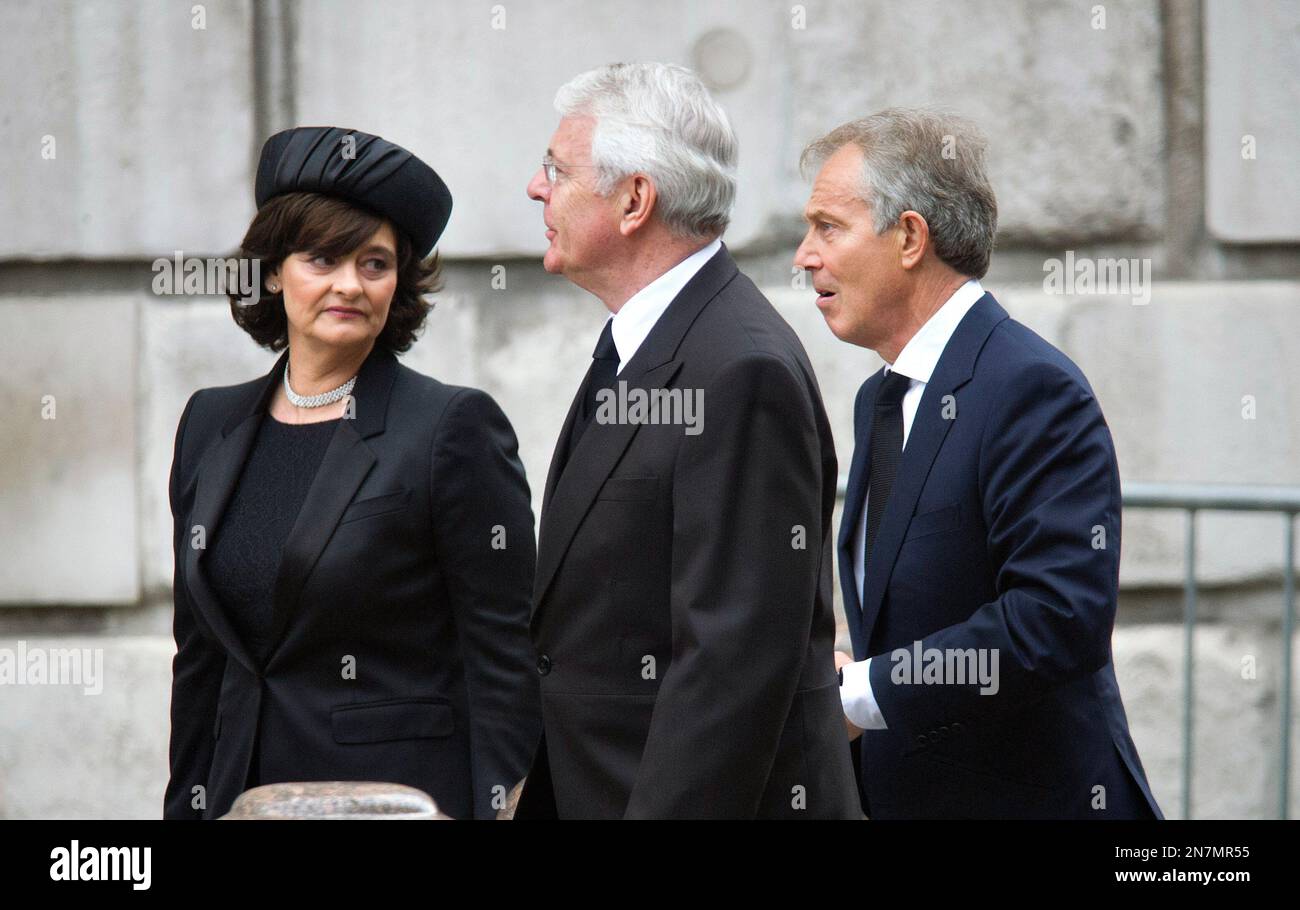 British former prime ministers Tony Blair, right, and his wife Cherie, left, and John Major ...