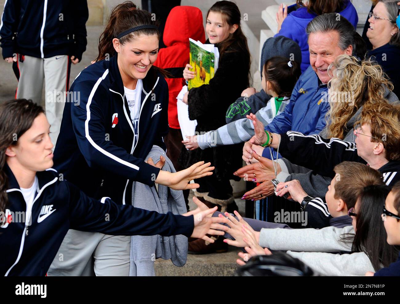 Connecticut's Kelly Faris, left, and Stefanie Dolson, right, greet fans ...