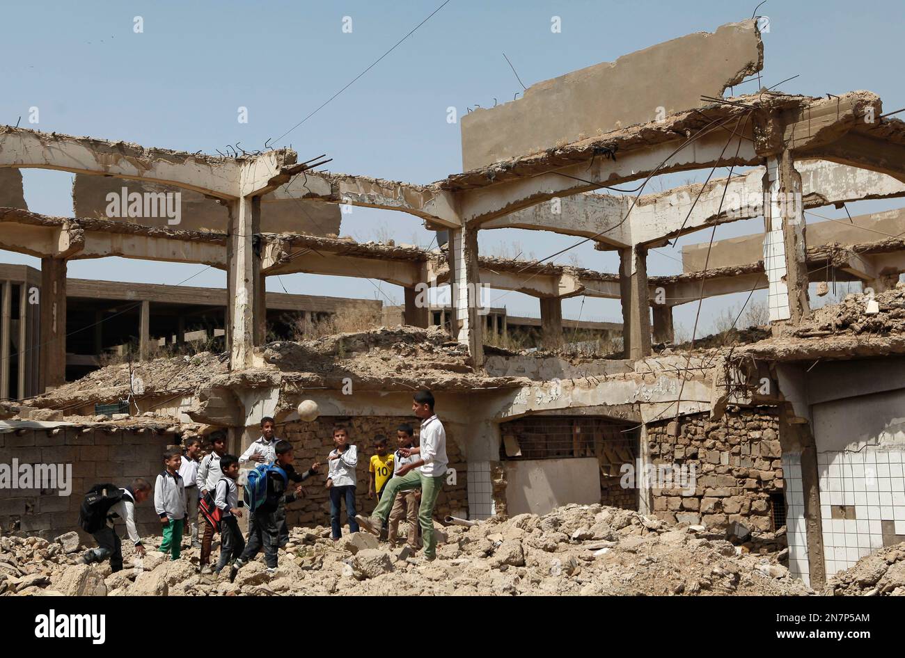In this Sunday, April 7, 2013 photo, homeless Iraqi children play ...