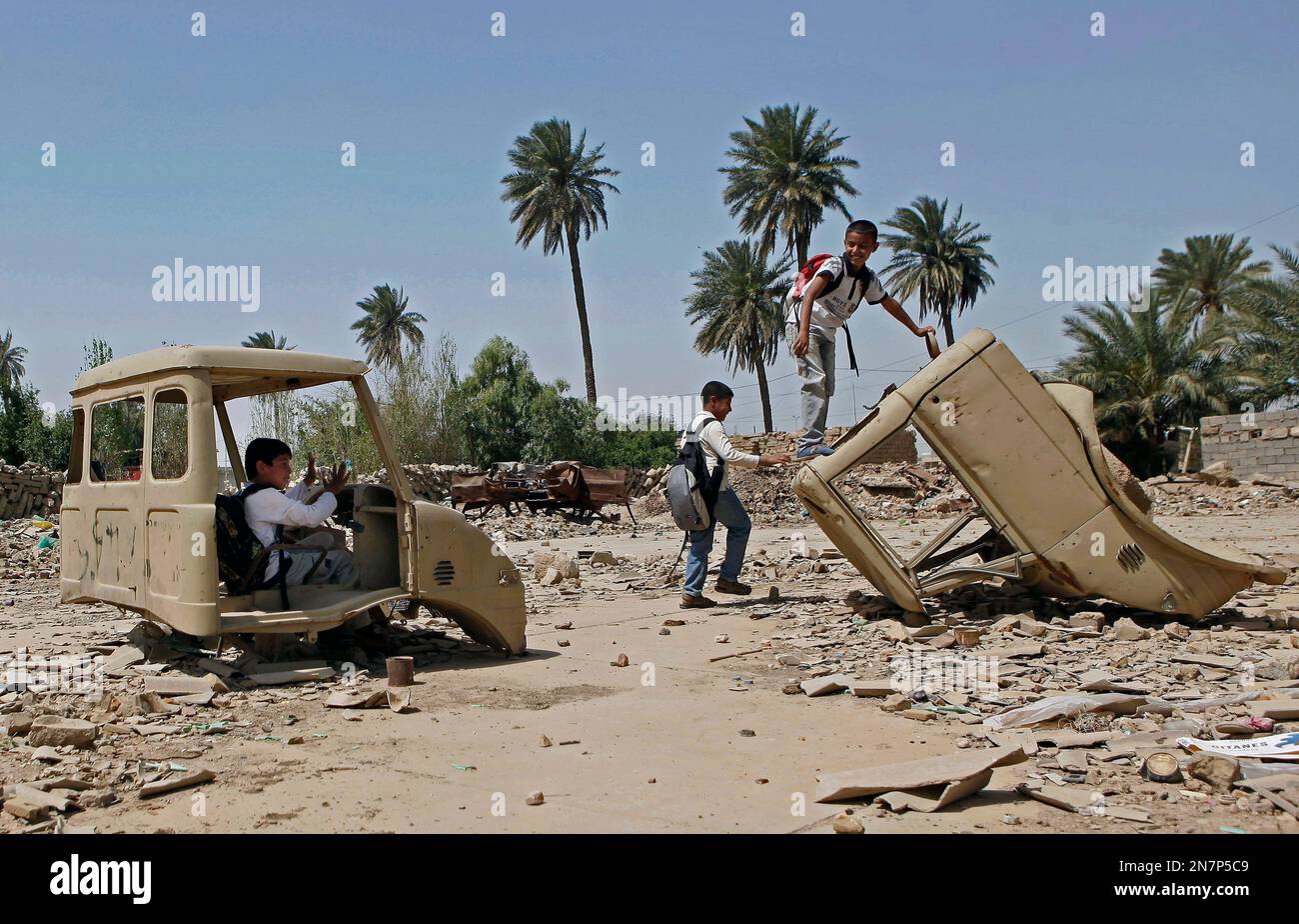 In this Sunday, April 7, 2013 photo, homeless Iraqi children play in ...