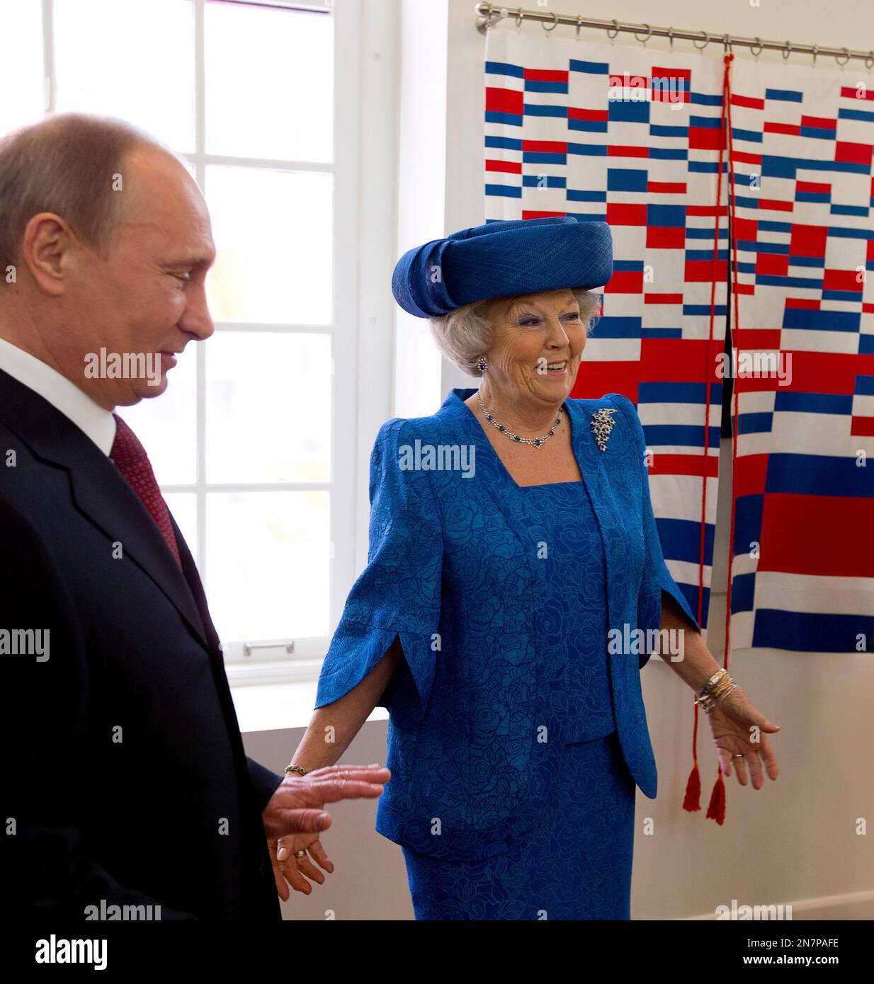 Russian President Vladimir Putin, left, and Dutch Queen Beatrix, left ...