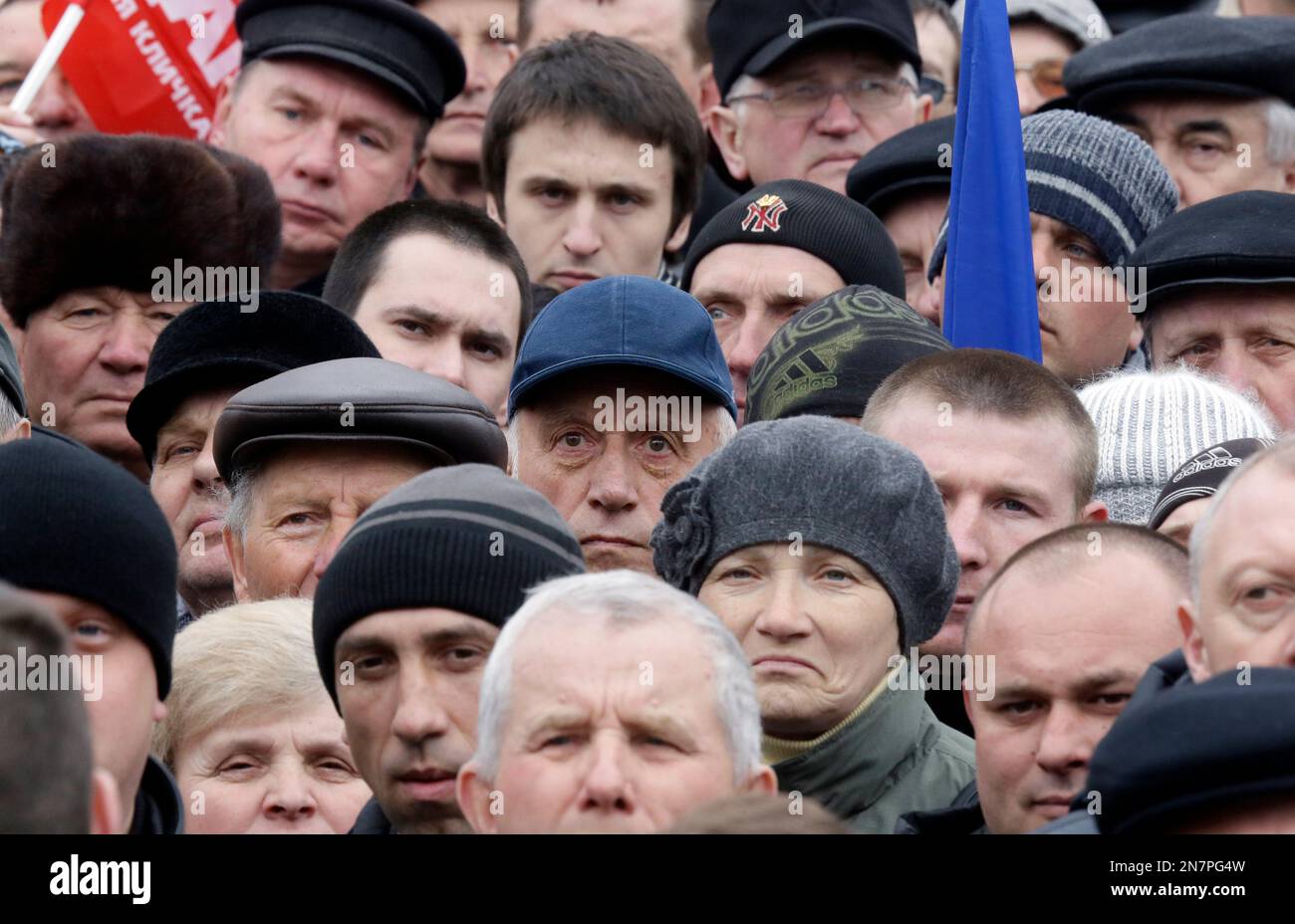 Supporters of the Ukrainian Opposition party listen to their leaders ...