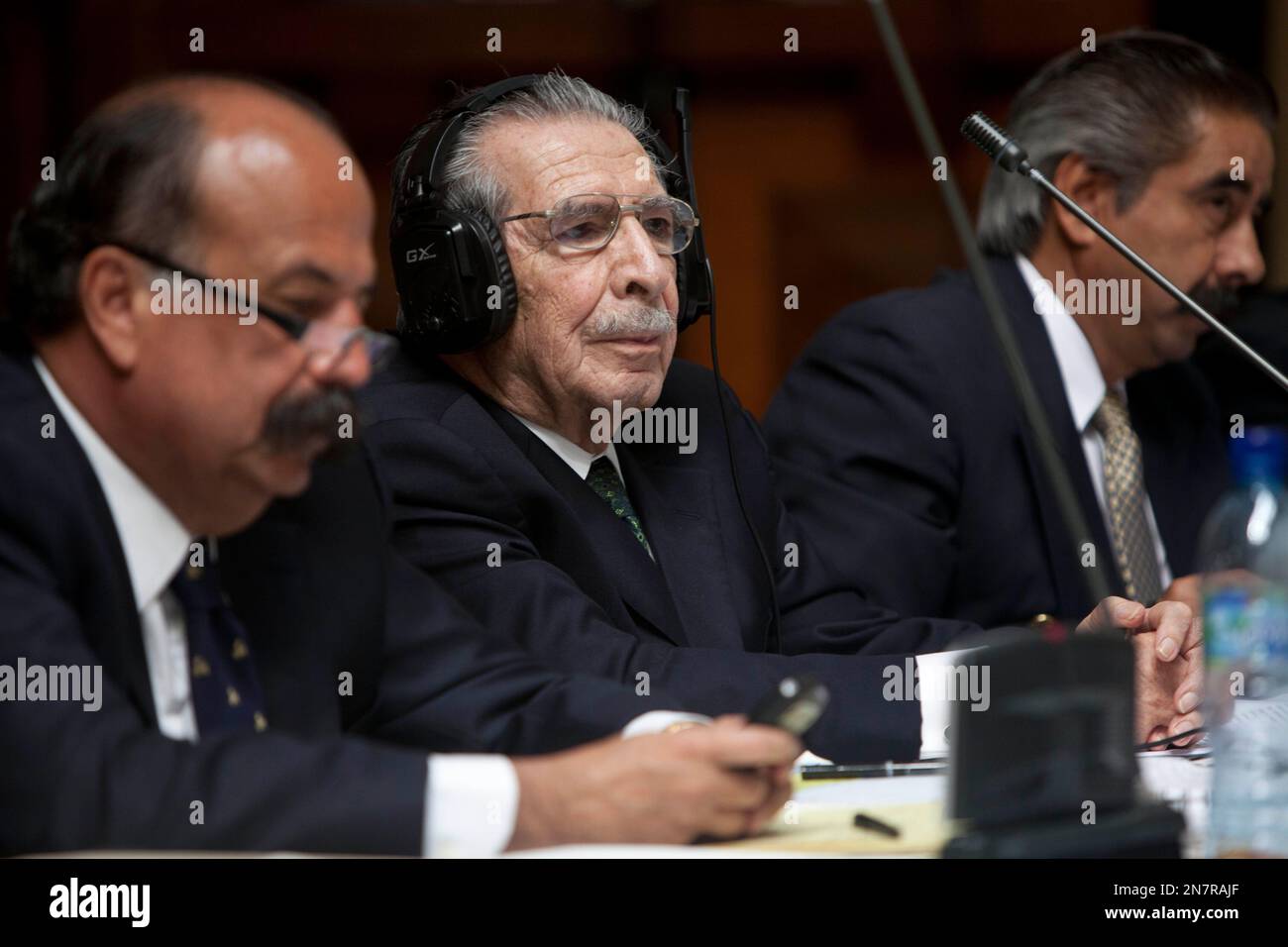 Guatemala's former dictator Jose Efrain Rios Montt, center wearing ...