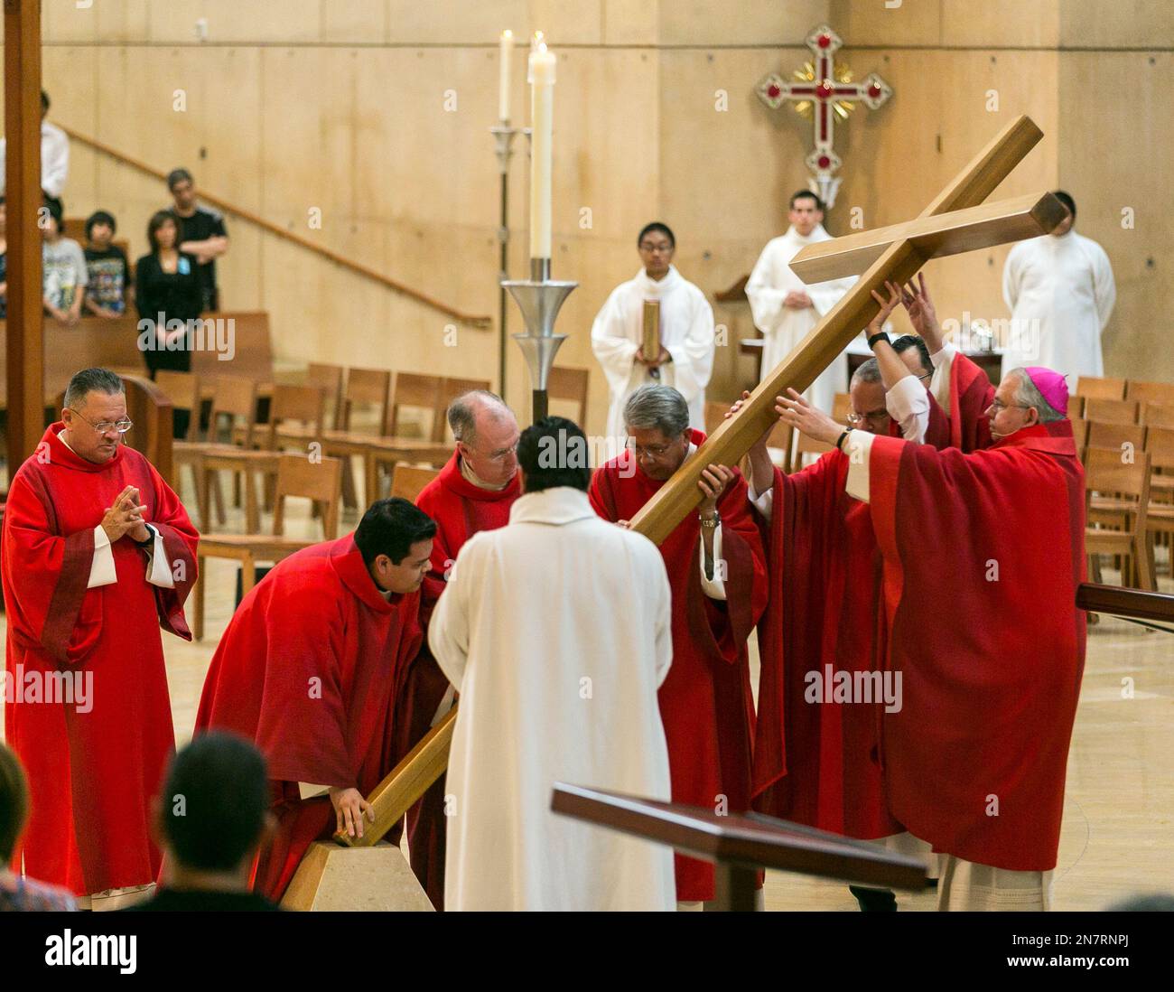 Los Angeles Archbishop Jose Gomez, far right, carries the cross at the ...