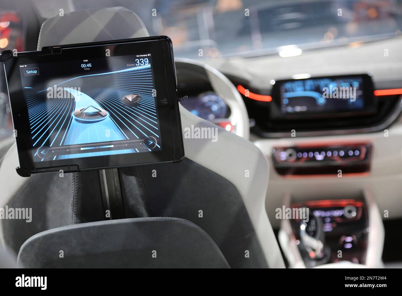 An ipod is attached to the back of the driver's seat in the BMW Concept ...