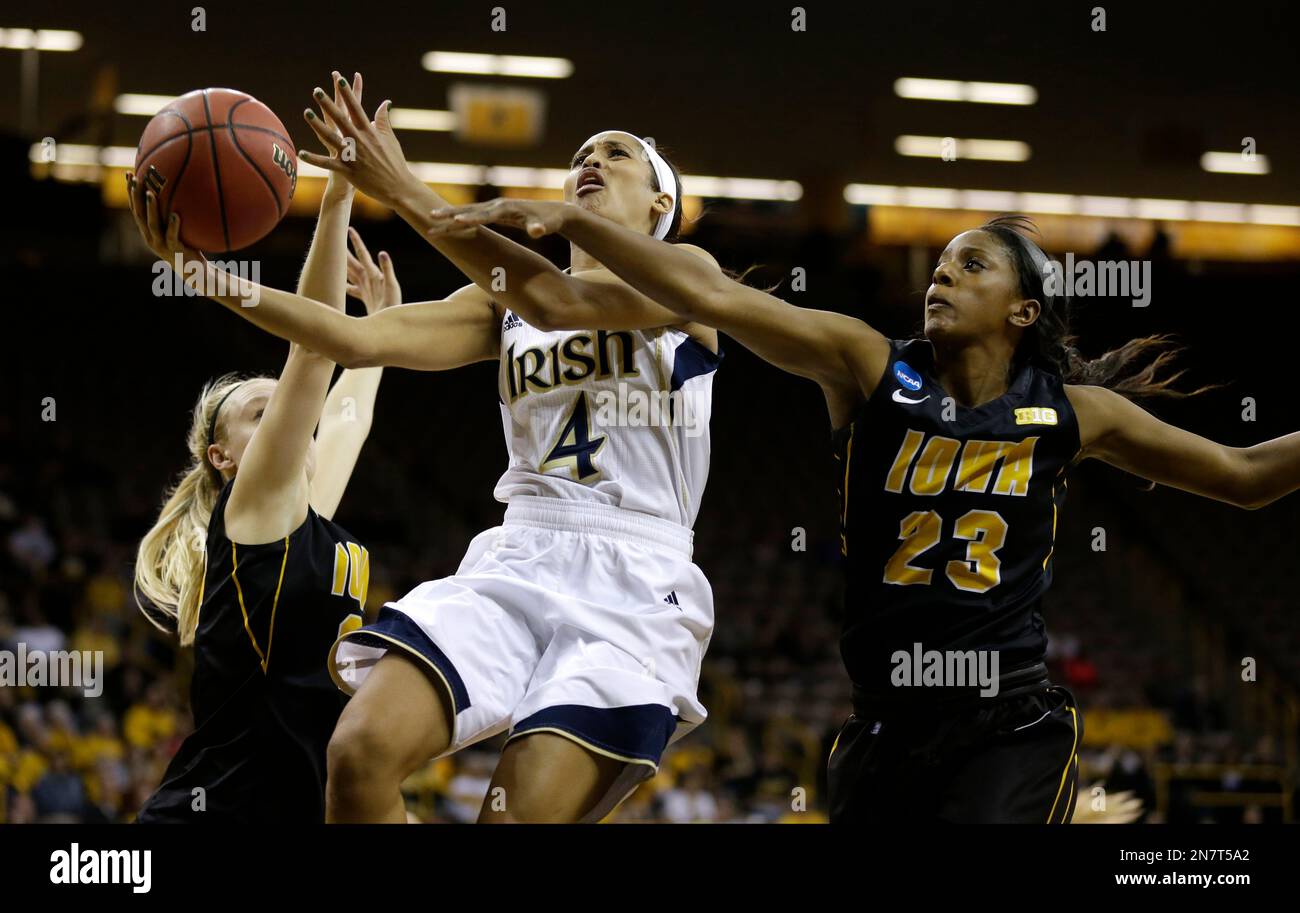 Notre Dame guard Skylar Diggins, center, drives to the basket between ...