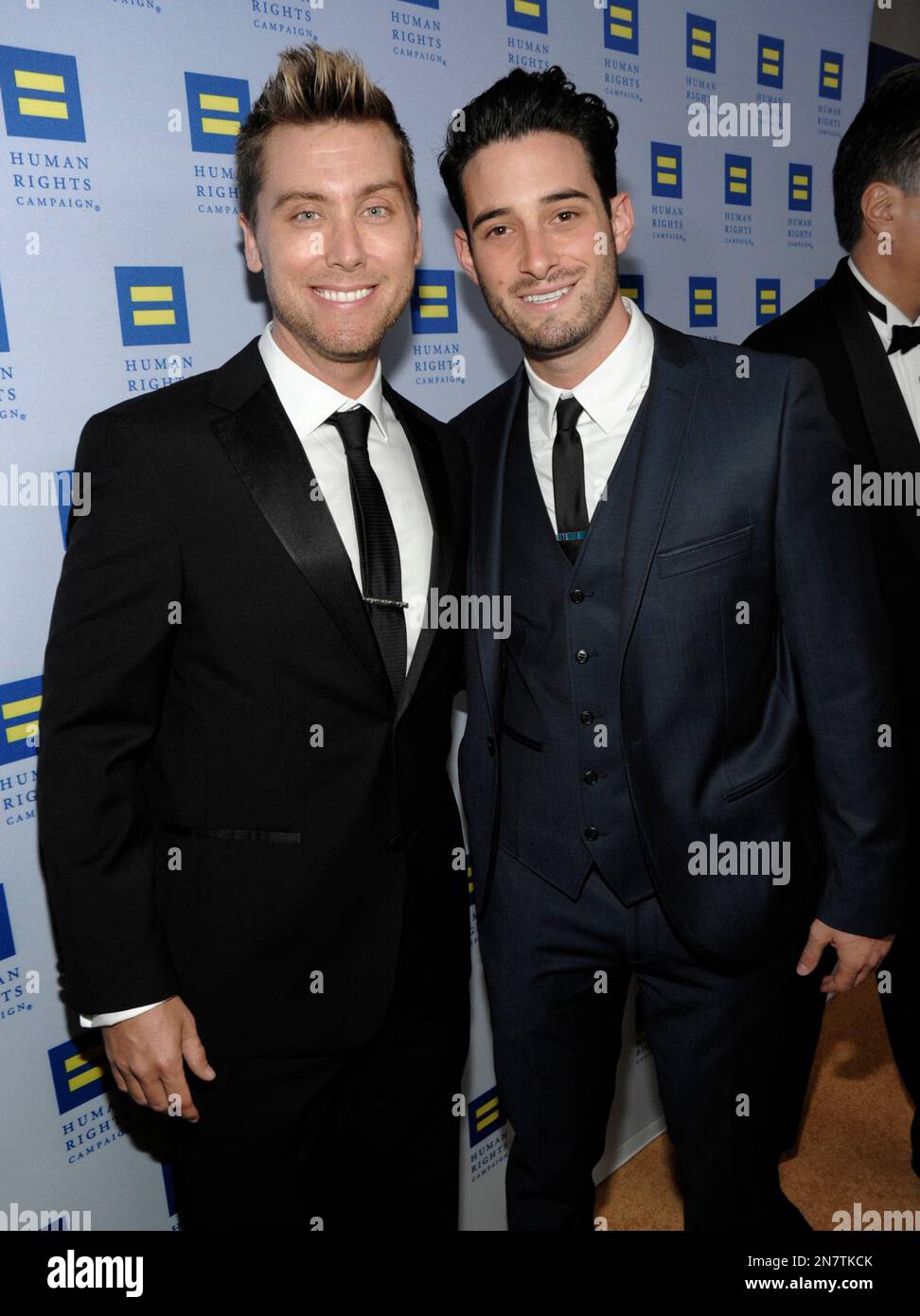 Singer and actor Lance Bass, left, and Michael Turchin arrive at the ...