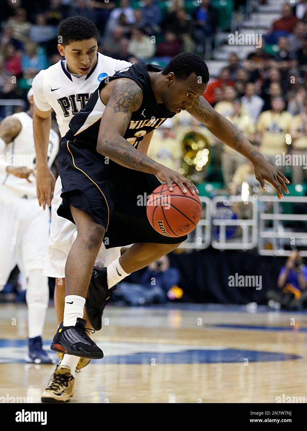 Wichita State's Malcolm Armstead, right, is fouled by Pittsburgh's ...